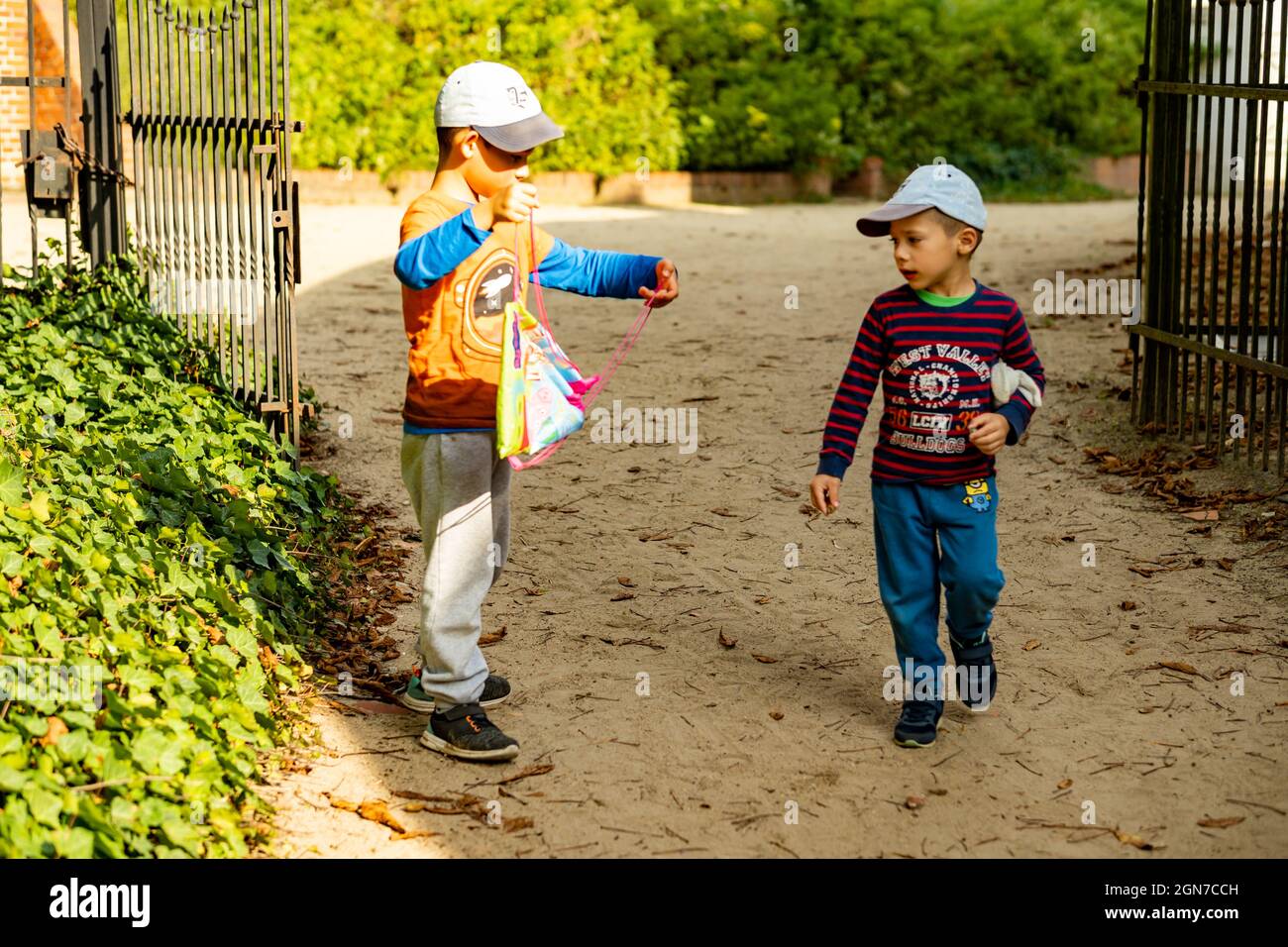 ROGALIN, POLAND - Sep 04, 2021: The Two young boys collecting things in ...