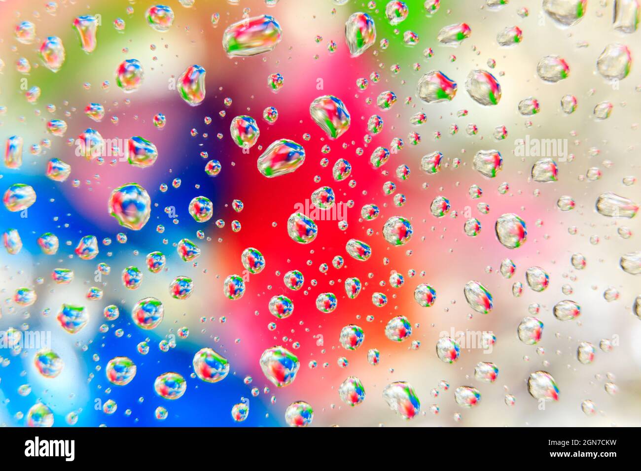 Multi colour water droplet background Stock Photo - Alamy