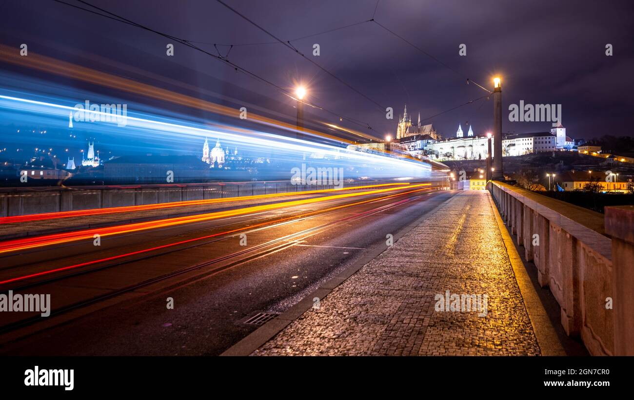 Night tram in Prague. Motion blurred tram on Manes Bridge with ...