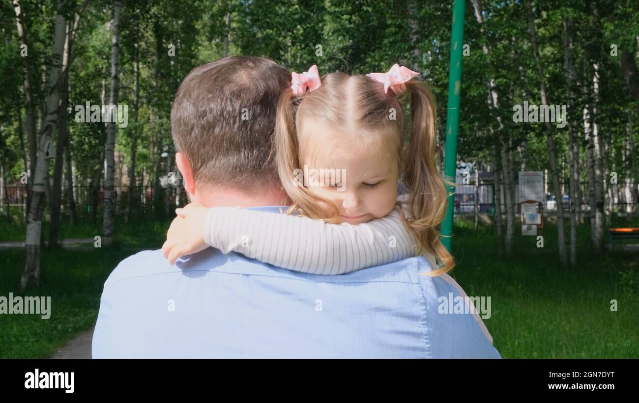 Happy father carrying around his neck and hugging daughter 4-5 years ...