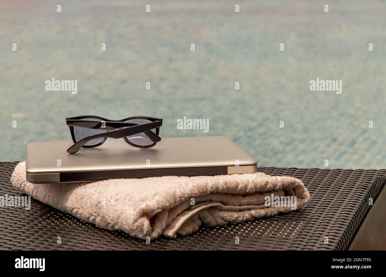 Relaxing moment by the pool. Take a break from working on laptop for a ...