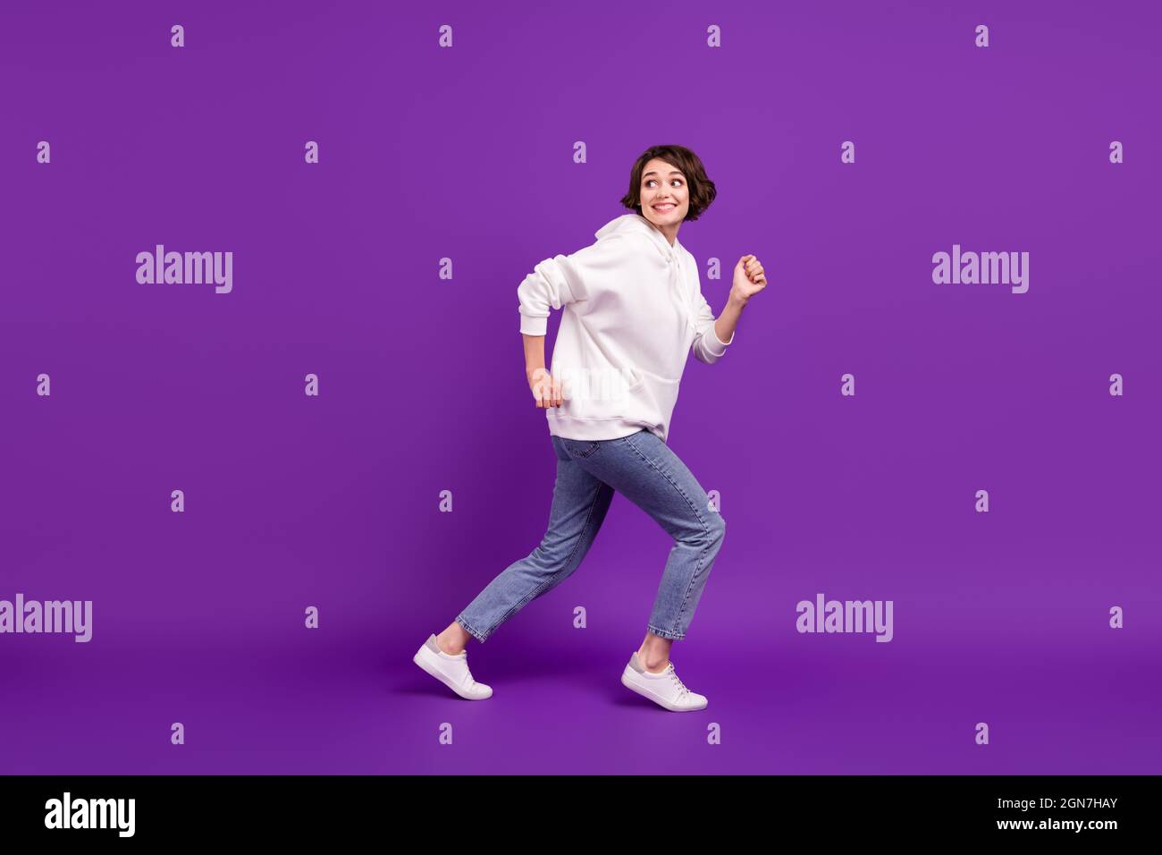 Full size profile side photo of young good mood girl running away ...