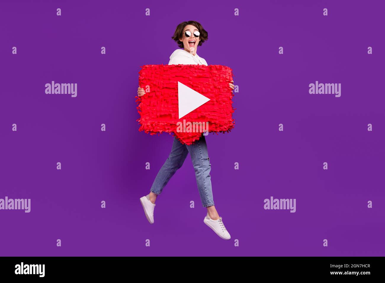 Full size photo of excited smiling cheerful girl jumping hold paper ...