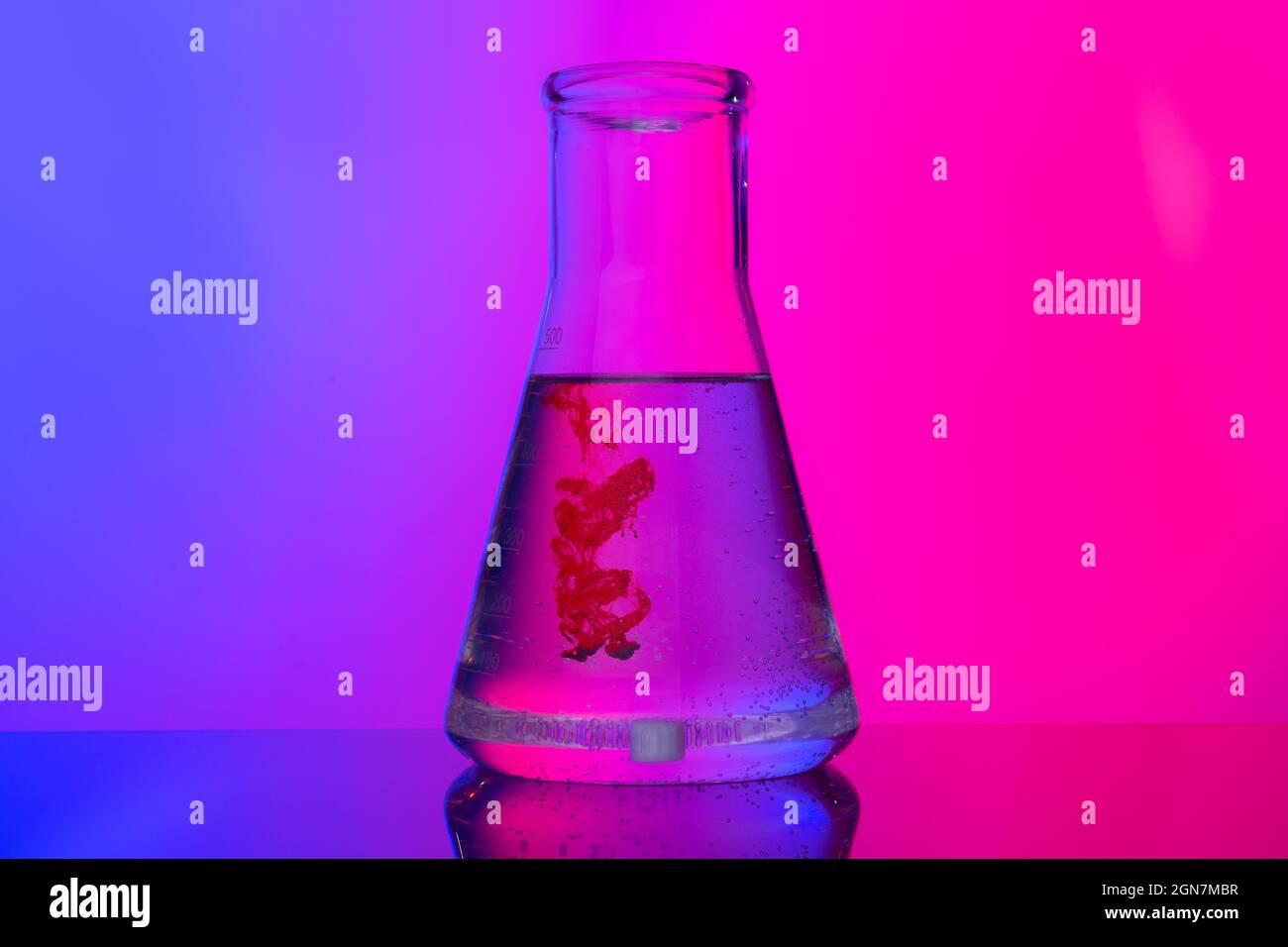 Laboratory glass tubes with chemicals on bright pink background Stock ...