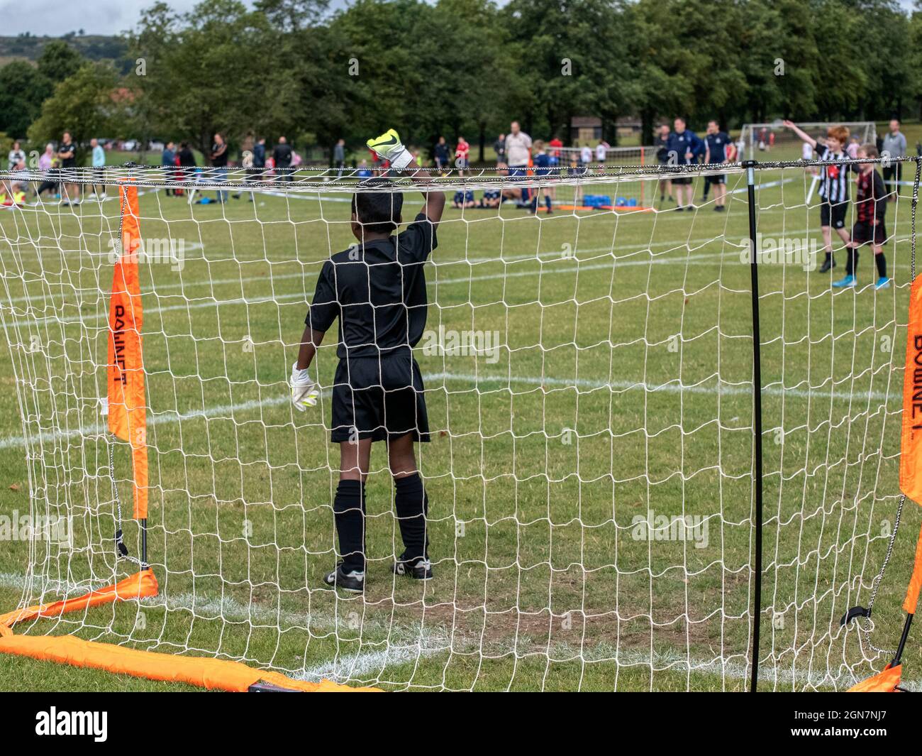 Barrhead, Scotland, UK. 8th August 2021: A young Asian goalkeeper ...