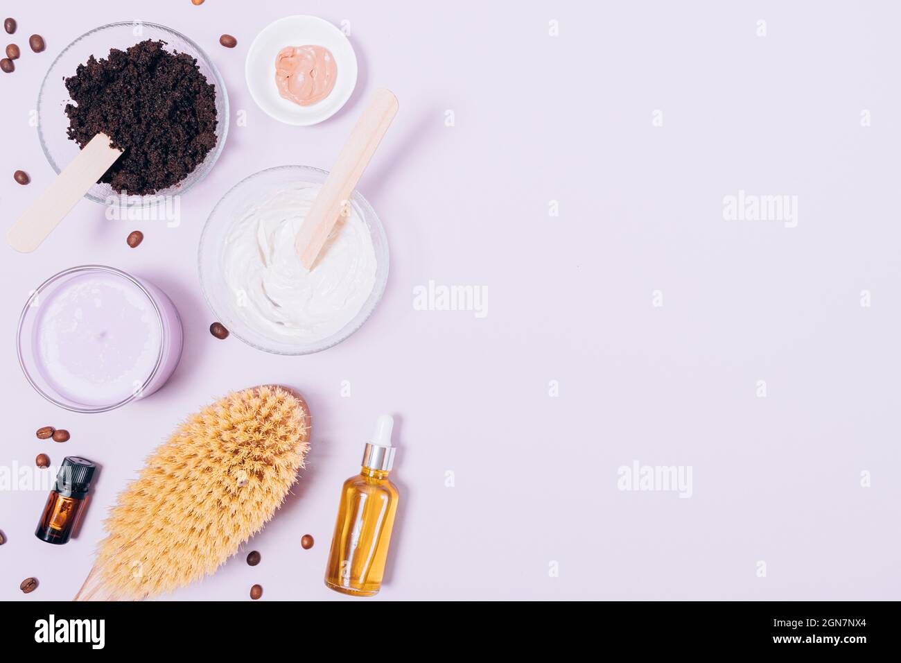 Top view set of homemade natural cosmetics on lilac background with ...