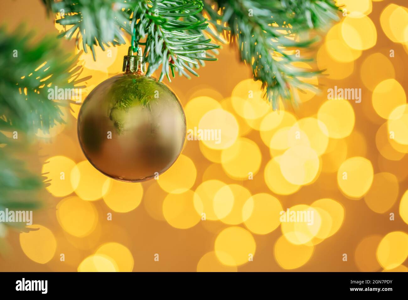 Christmas tree background with golden bauble on bokeh sparkling Stock ...