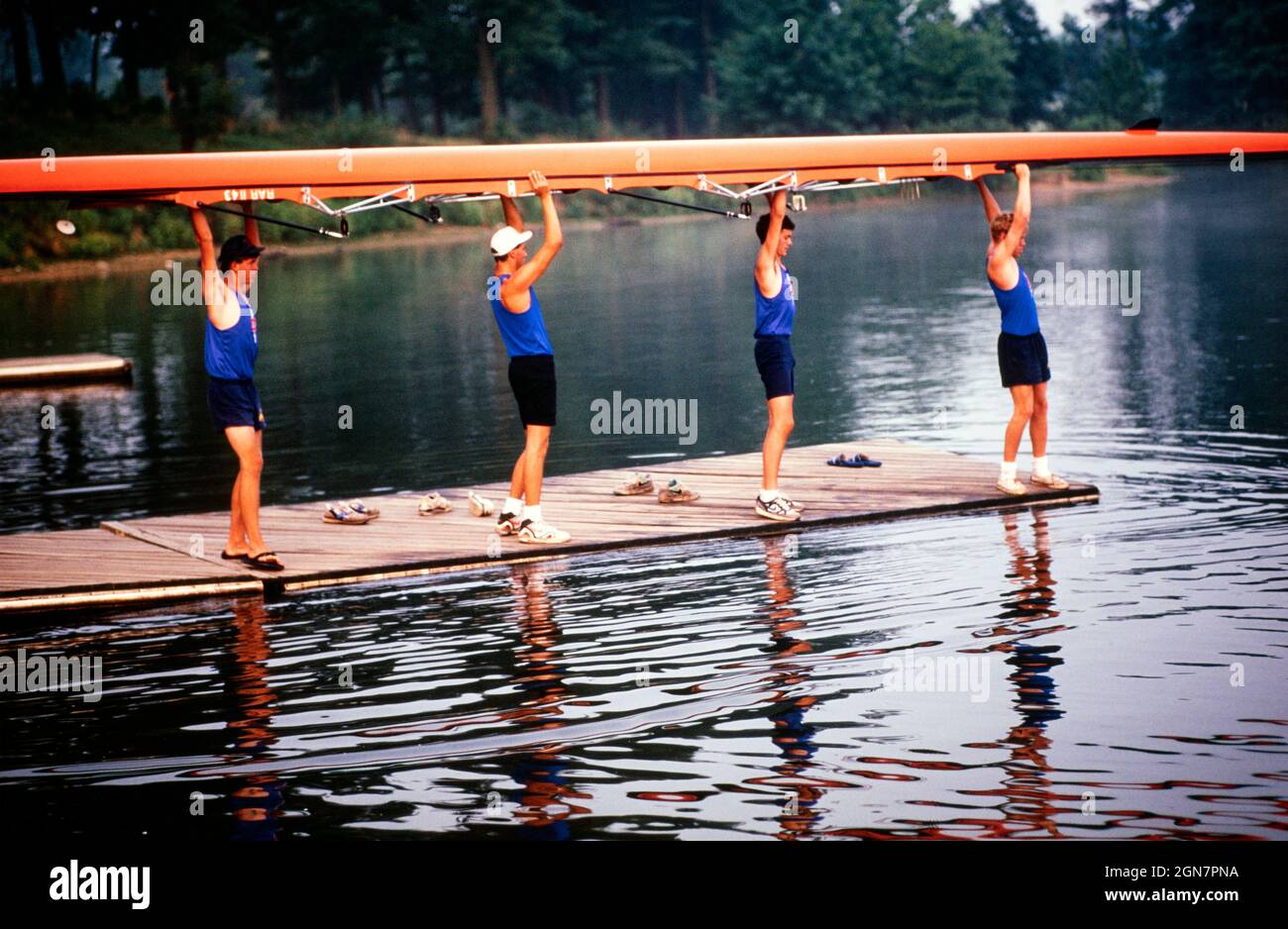 Scullers getting ready to put a boat in the water in Craftsbury Vermont ...