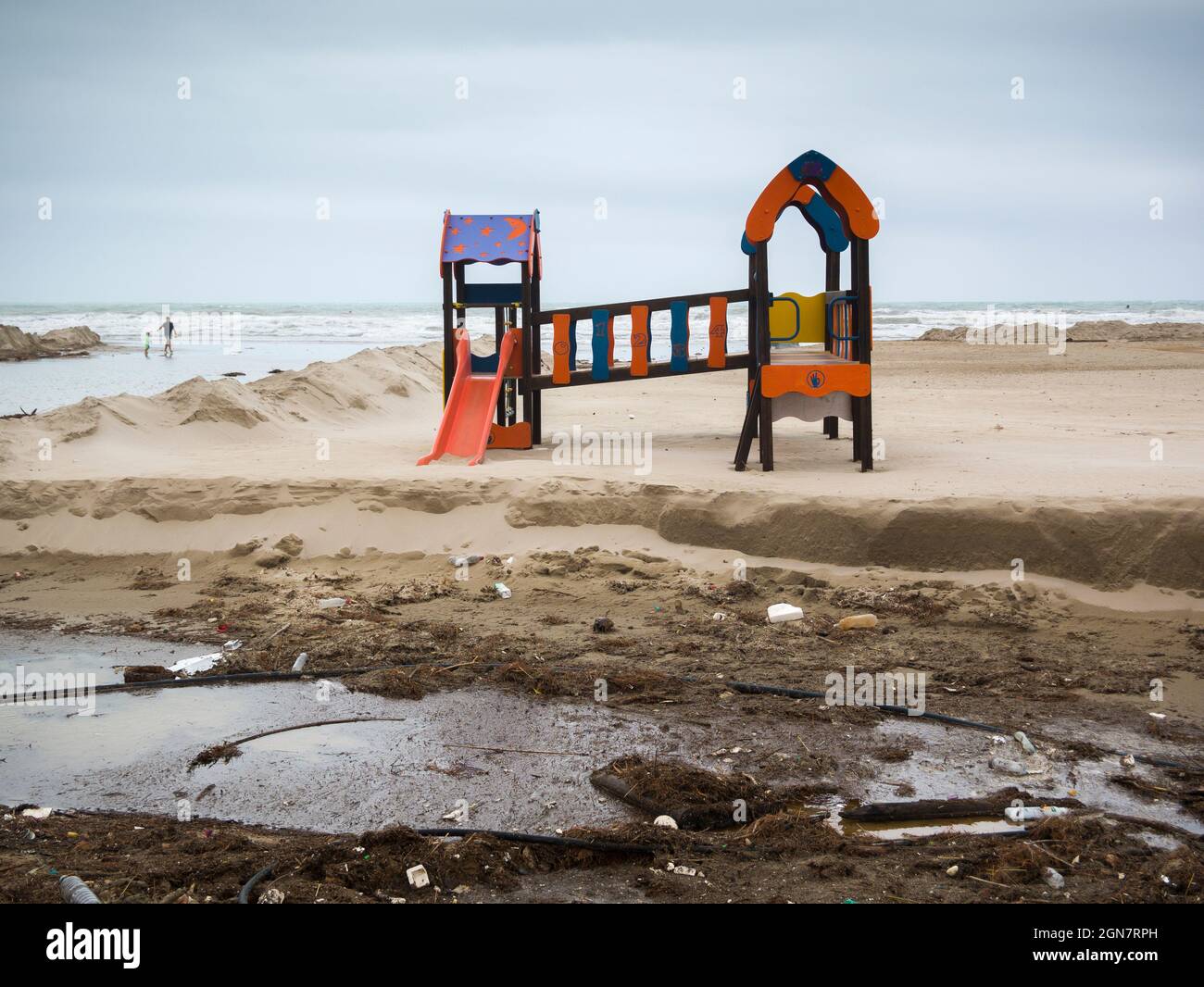 Storm damage caused by floodwater flowing into the sea at La Zenia ...