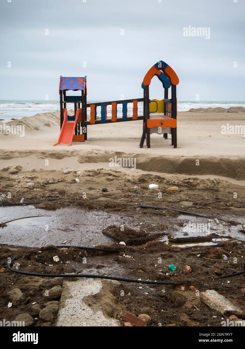 Storm damage caused by floodwater flowing into the sea at La Zenia ...