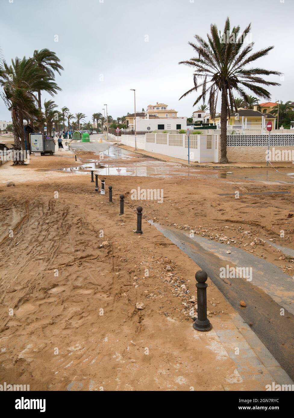 Storm damage caused by floodwater flowing into the sea at La Zenia ...