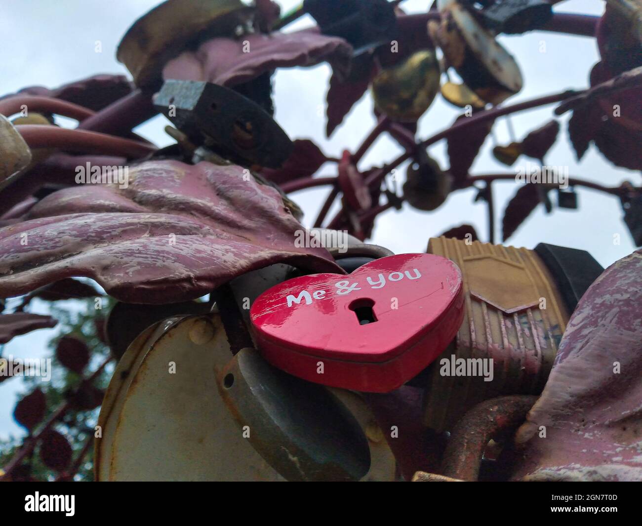 An old red heart shaped rusty wedding lock, concept of eternal love ...