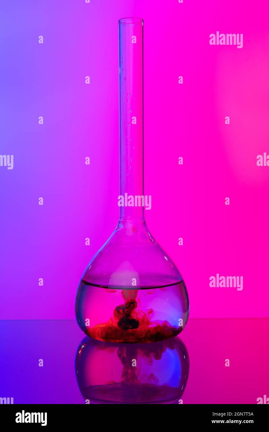 Laboratory glass tubes with chemicals on bright pink background Stock ...