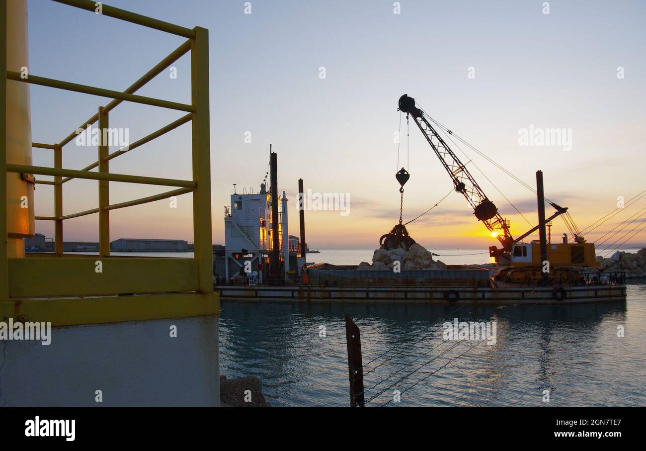 Floating platform with crane, used for the transport of boulders, in ...