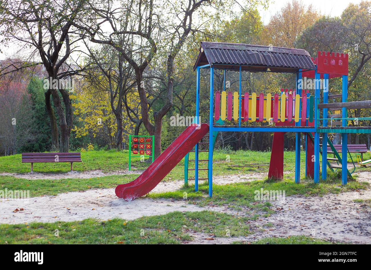 A bright playground surrounded by greenery, a beautiful and cozy park ...