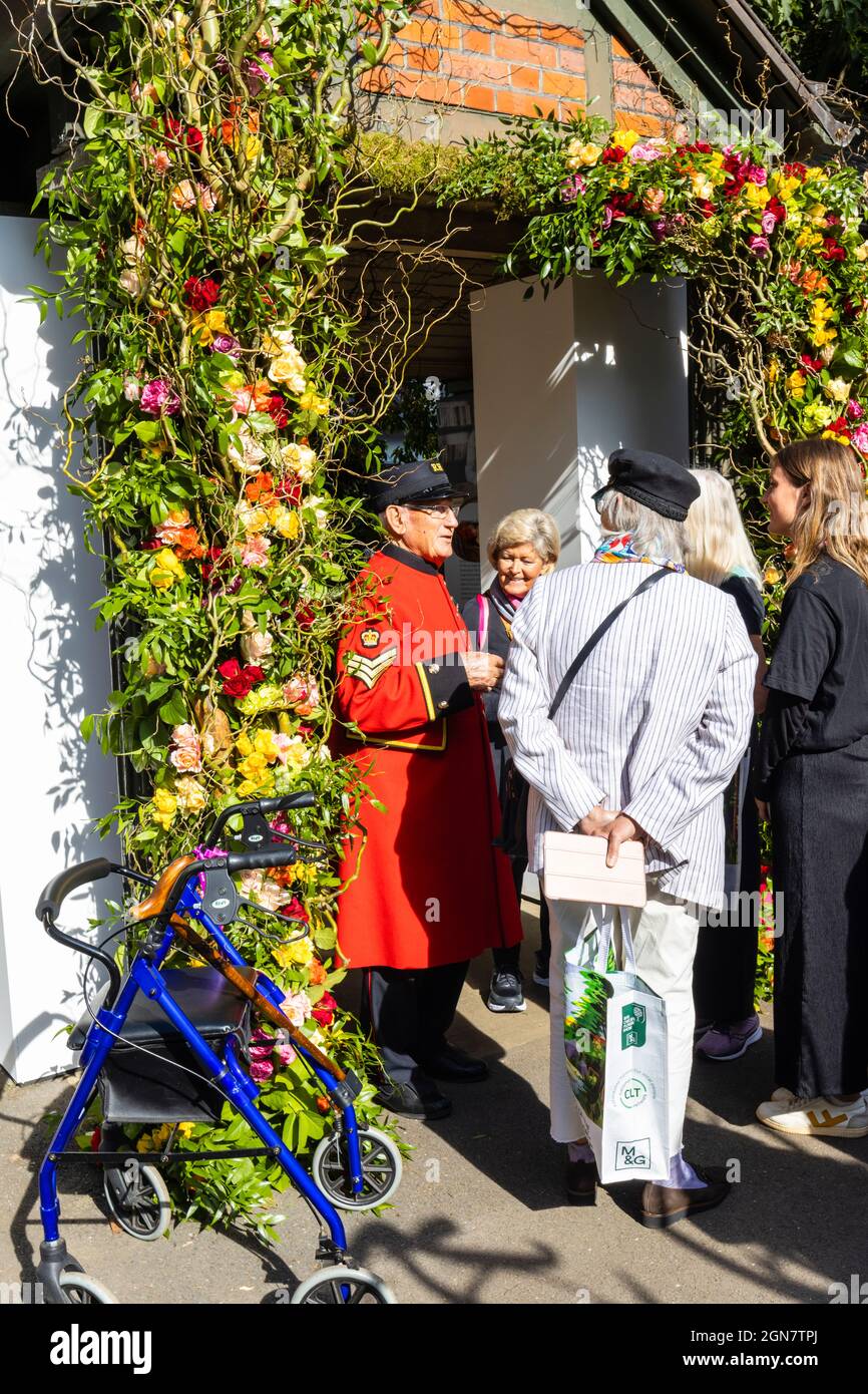 A red-coated Chelsea Pensioner at a Fairtrade stand, RHS Chelsea Flower ...