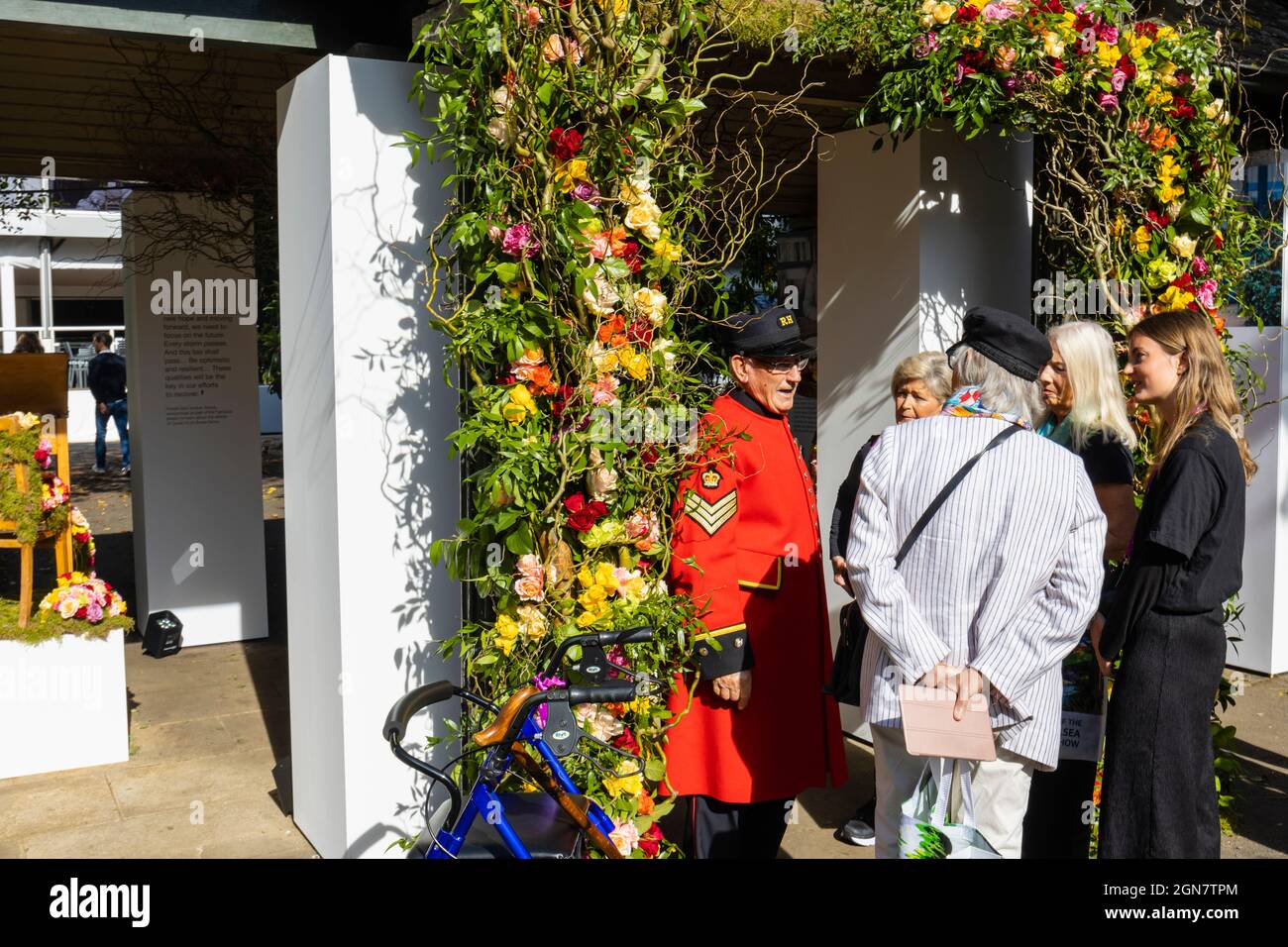 A red-coated Chelsea Pensioner at a Fairtrade stand, RHS Chelsea Flower ...