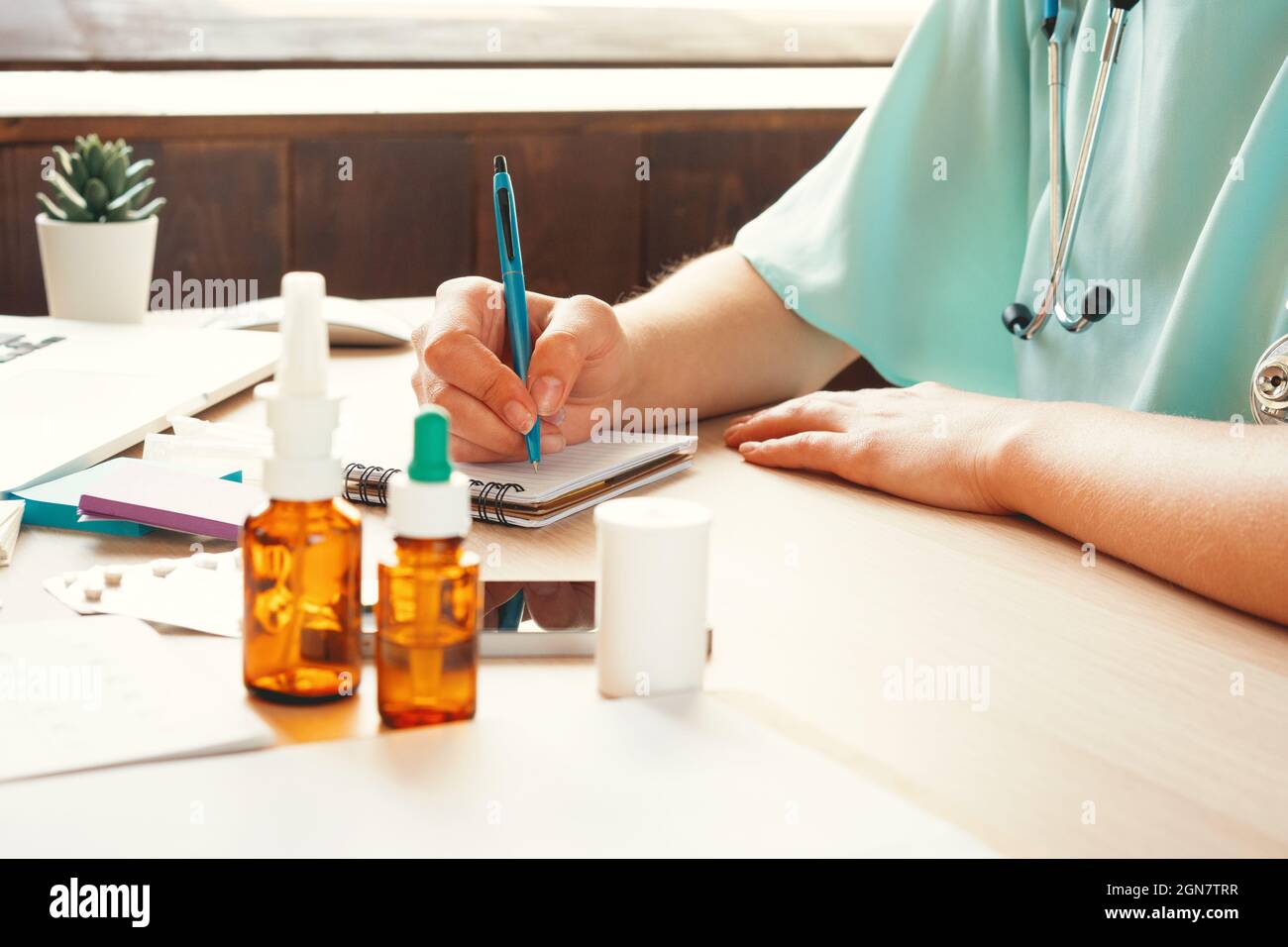 Female medicine doctor filling patient medical form or prescription ...