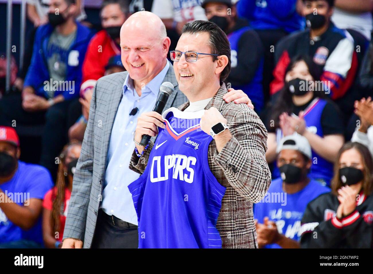 Intuit CEO Sasan Goodarzi is presented with a jersey during a ...