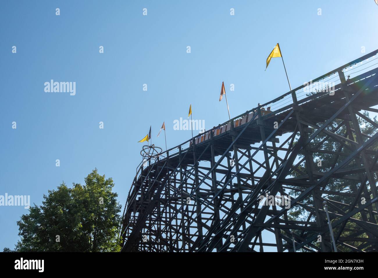 train climbing the lift hill on a wooden roller coaster Stock Photo - Alamy