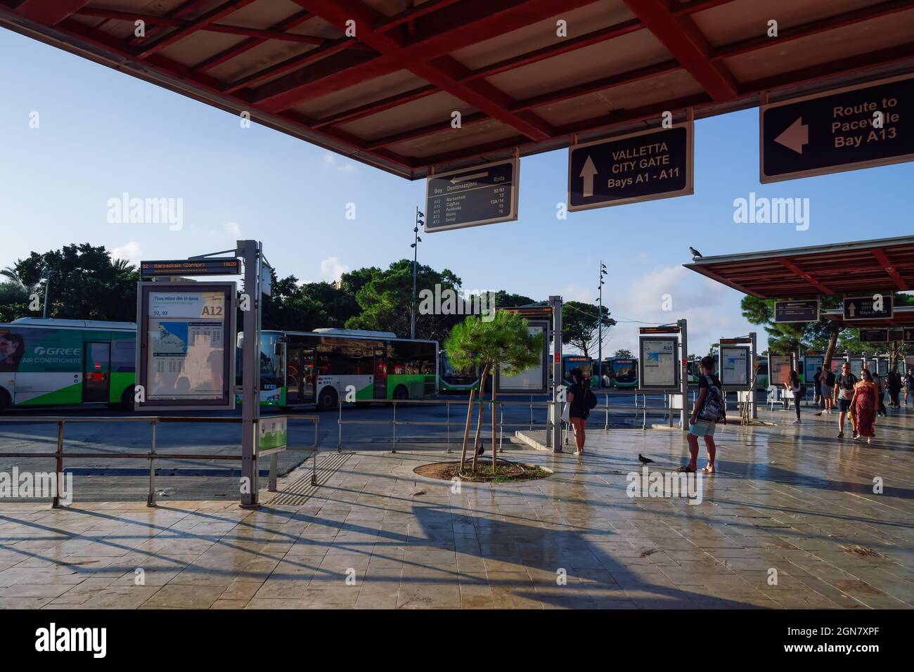 Valletta, Malta Public Transport Buses at terminal with crowd. Green ...