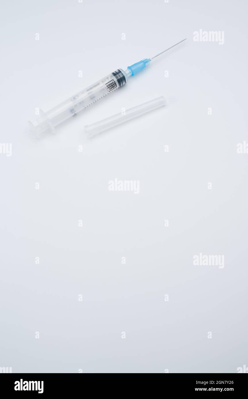 isolated sterilized injection syringe on a white background Stock Photo ...