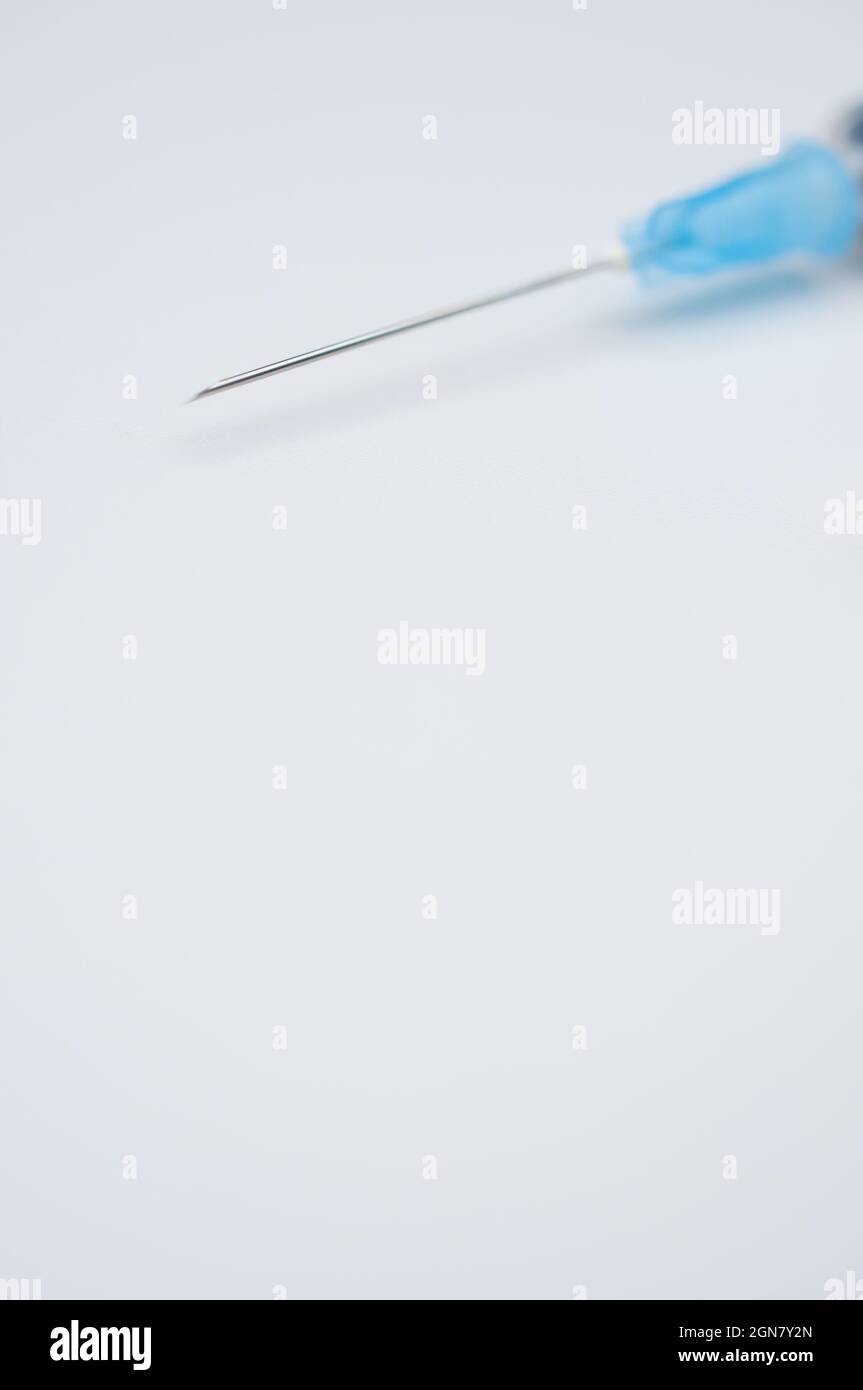 isolated sterilized injection syringe detail on a white background ...