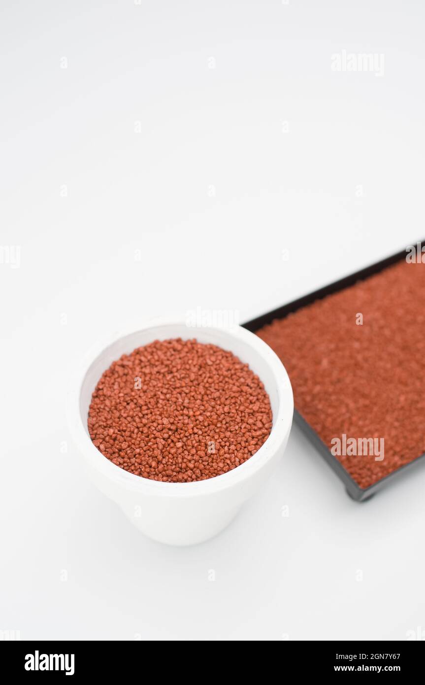 decorative orange colored sand in a metal box and white vase Stock ...