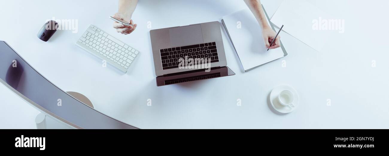Office workplace with computer and laptop. Creating new project ideas ...