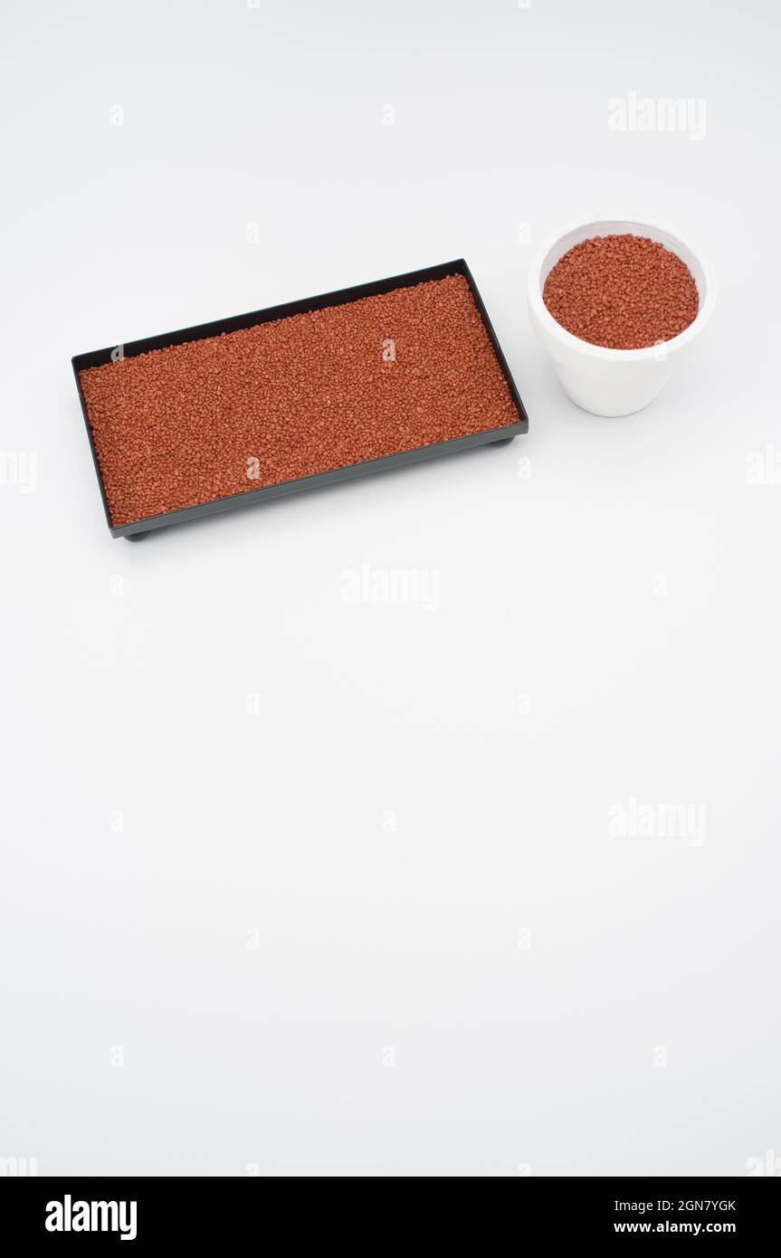 decorative orange colored sand in a metal box and white vase Stock ...