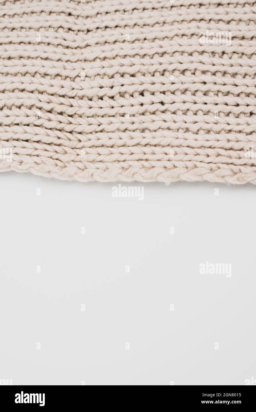 knitted soft natural wool on a white background Stock Photo - Alamy