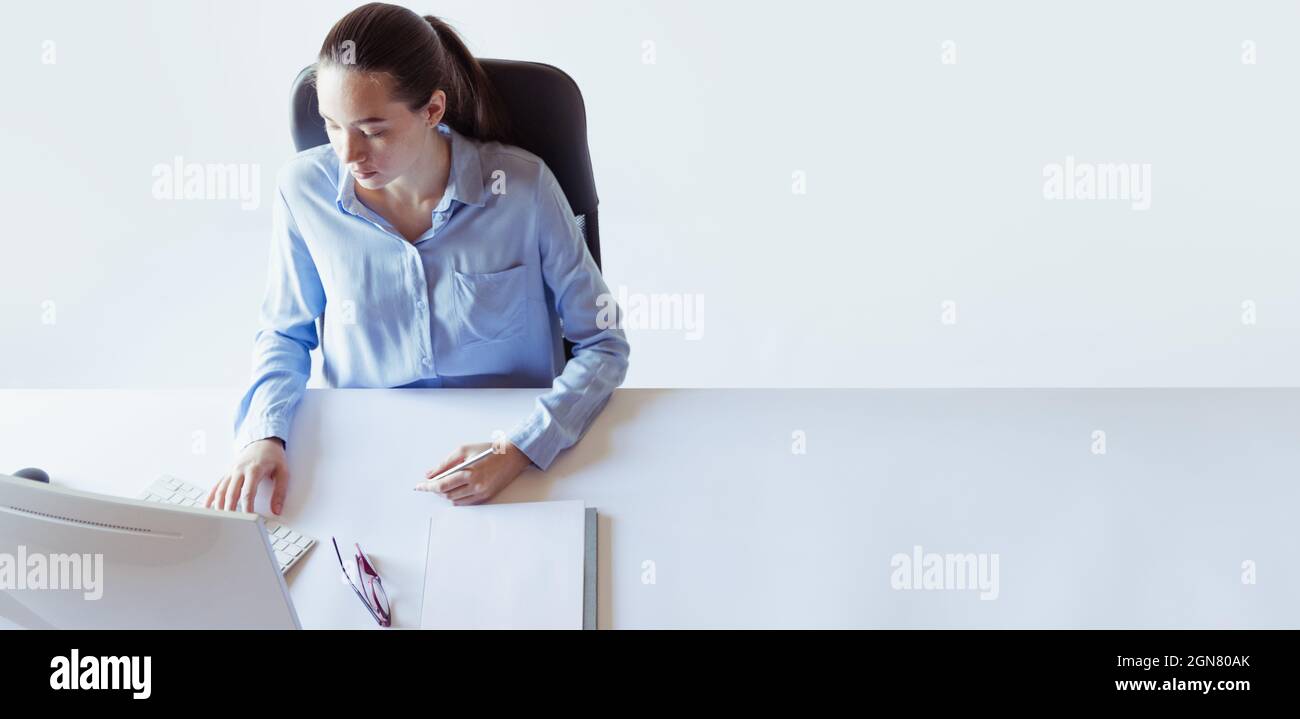 Female employee working with computer, creating and processing ideas in ...