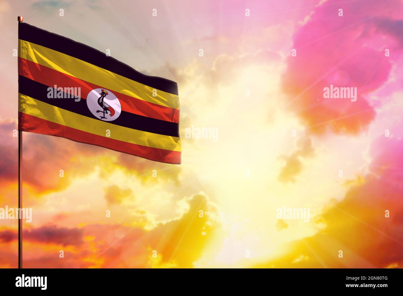 Fluttering Uganda flag in left top corner mockup with the place for ...