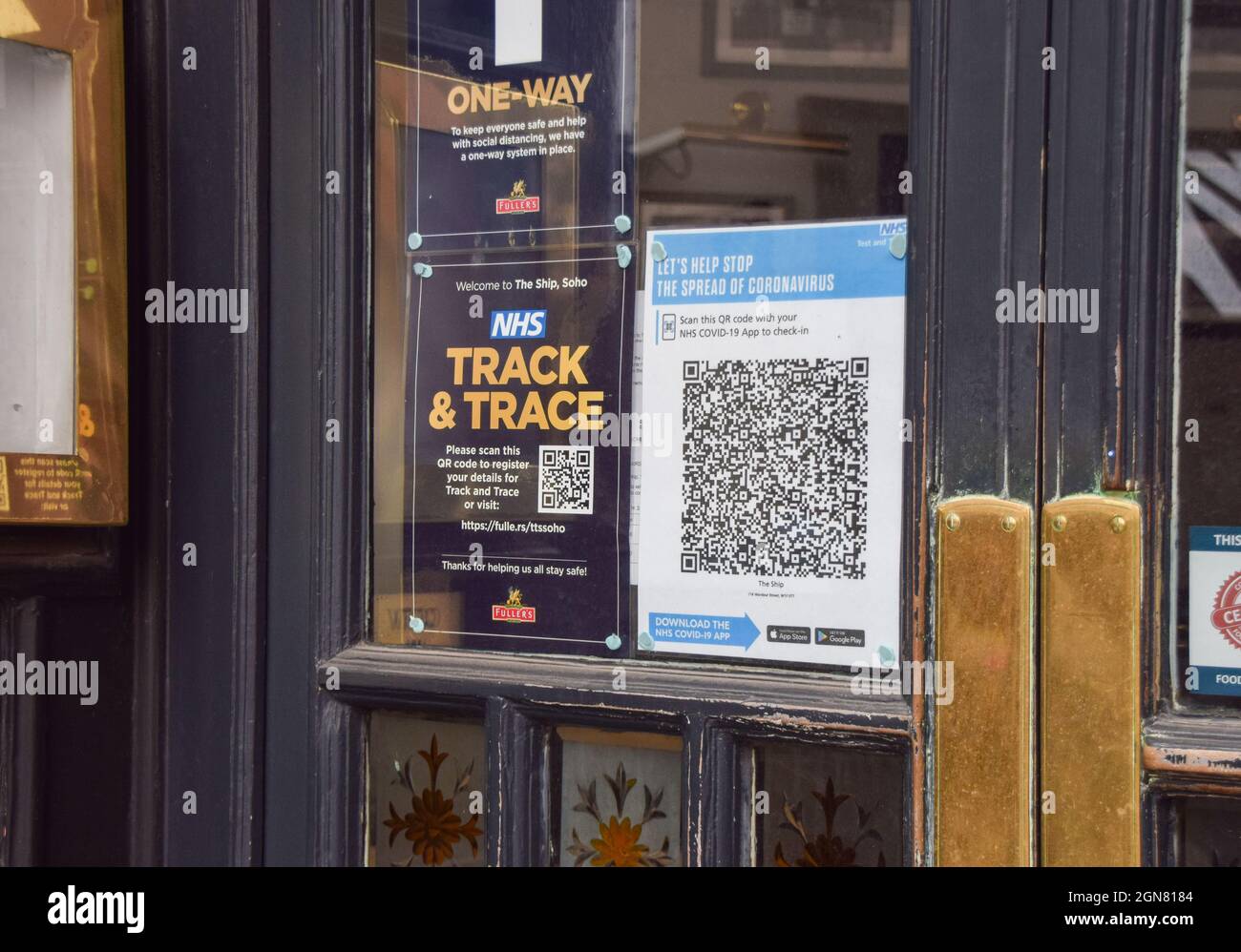 An NHS Track and Trace sign at a pub in Soho during the coronavirus ...