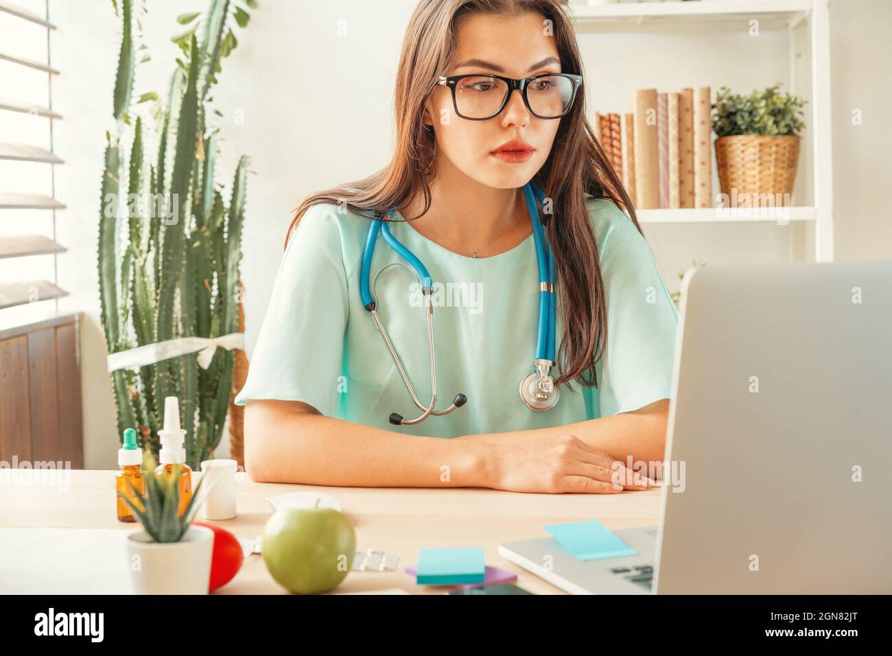 Female medicine doctor filling patient medical form or prescription ...