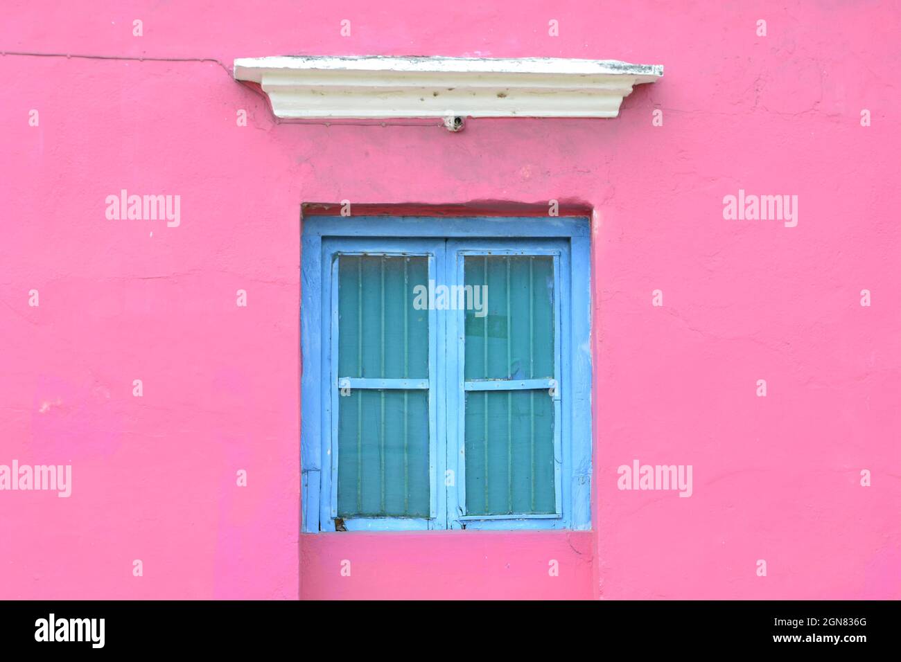 pink wall and blue window background Stock Photo - Alamy