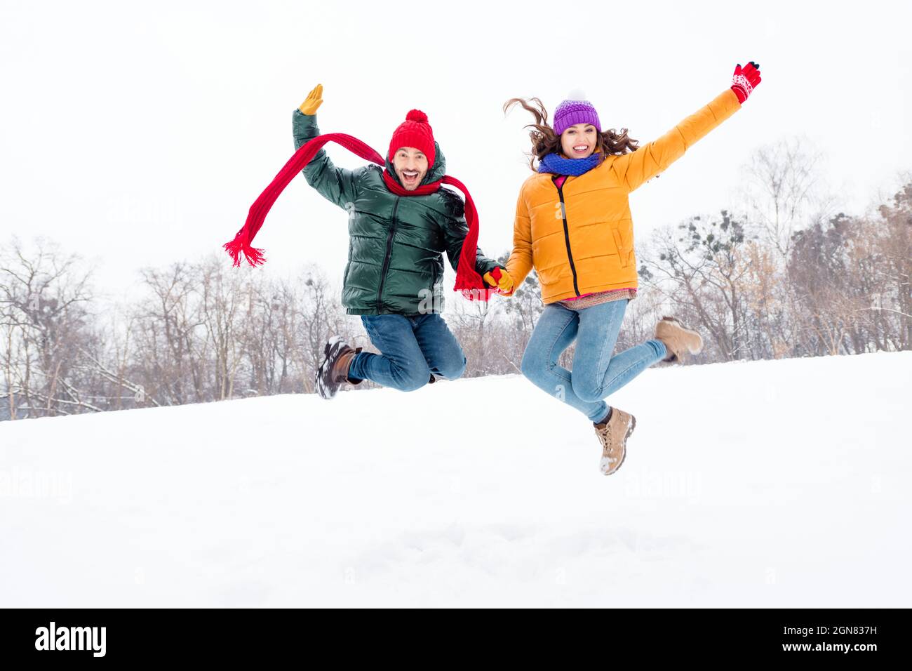 Full size photo of young cheerful couple happy positive smile jump fly ...