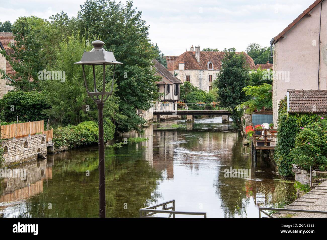 The River Beze flowing through the village of Beze in Cote d'Or ...