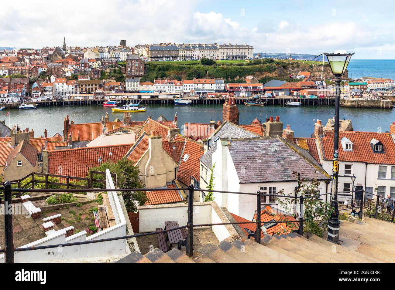 View of Whitby harbour showing fishing boats and private yachts in the ...