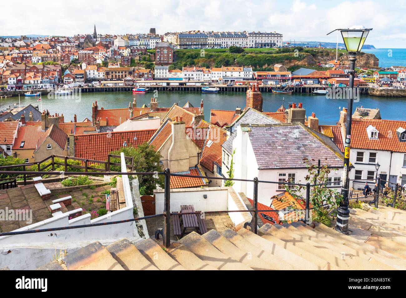 View of Whitby harbour showing fishing boats and private yachts in the ...