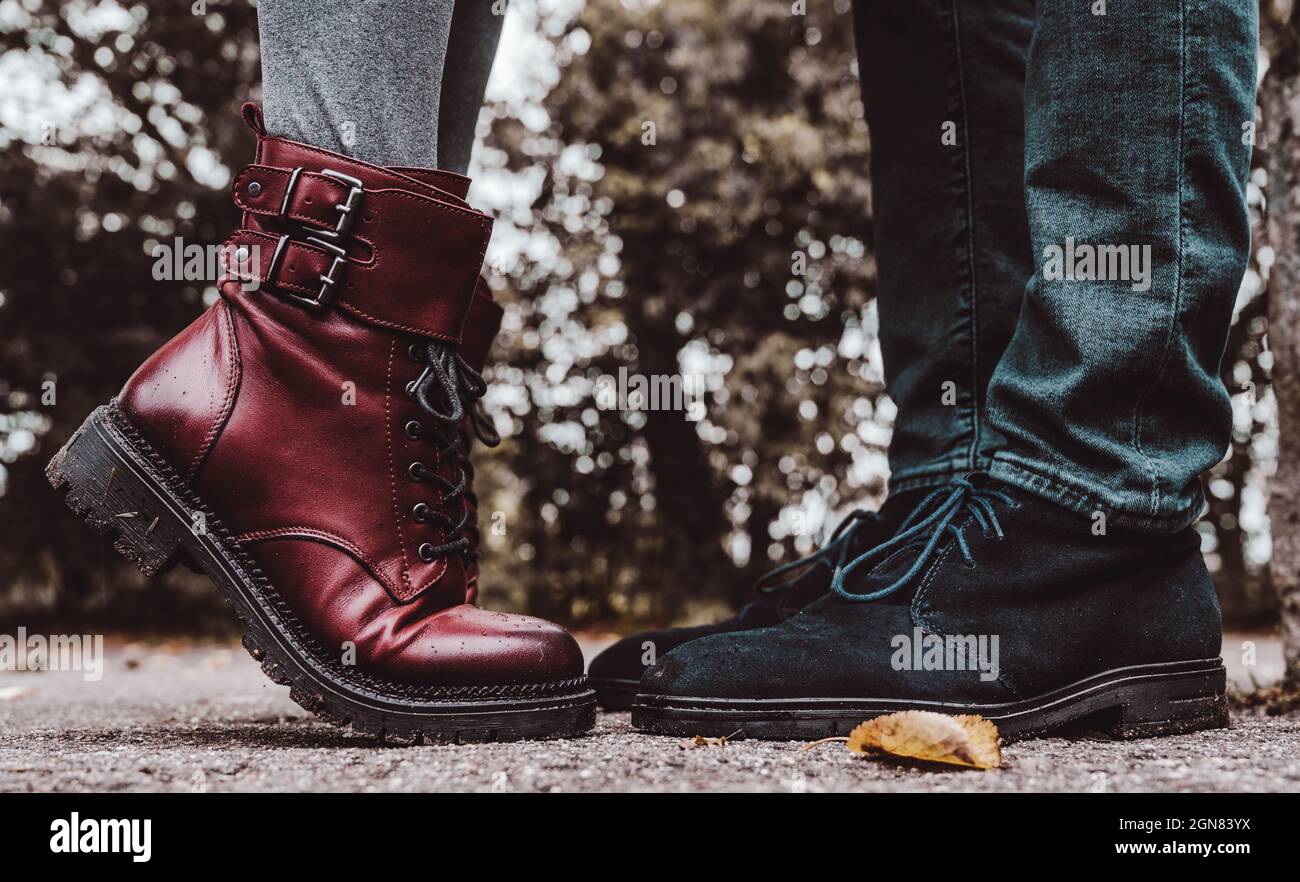 Feet of couple. Man and woman is standing opposite each other. Close-up ...