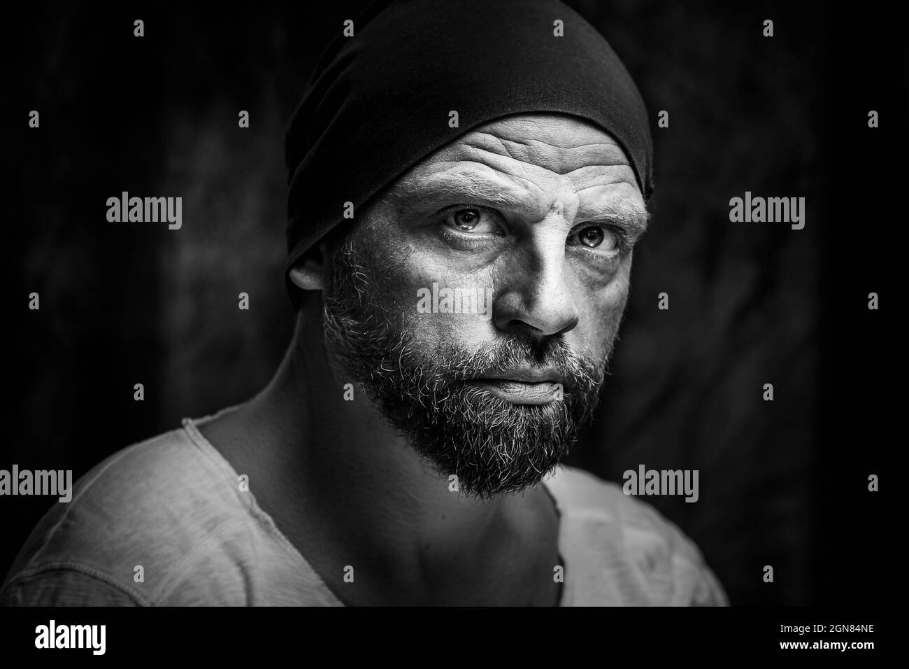 Grayscale of a Caucasian man feircely looking at the camera with a ...