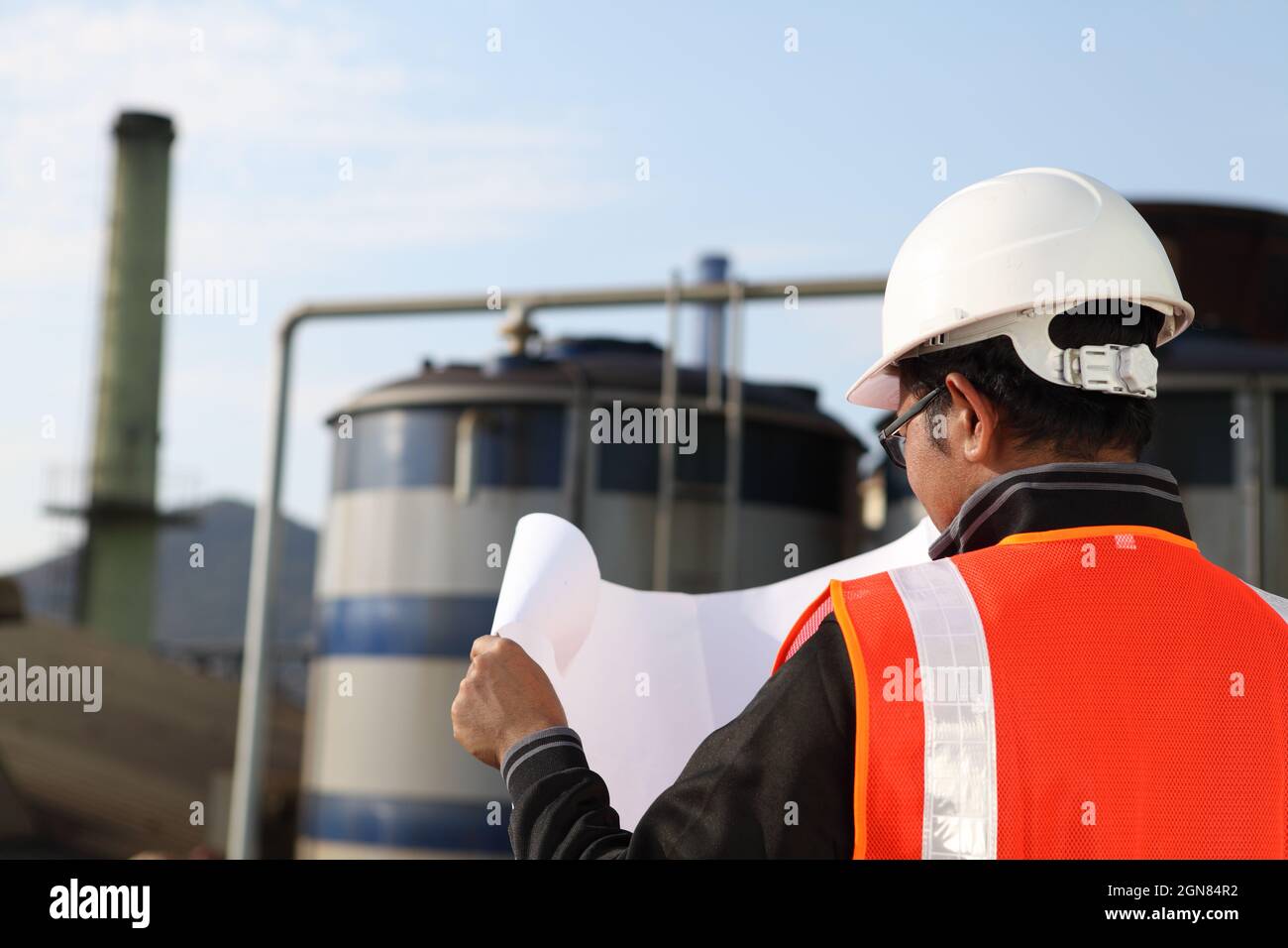 engineer checking a drawing Stock Photo - Alamy
