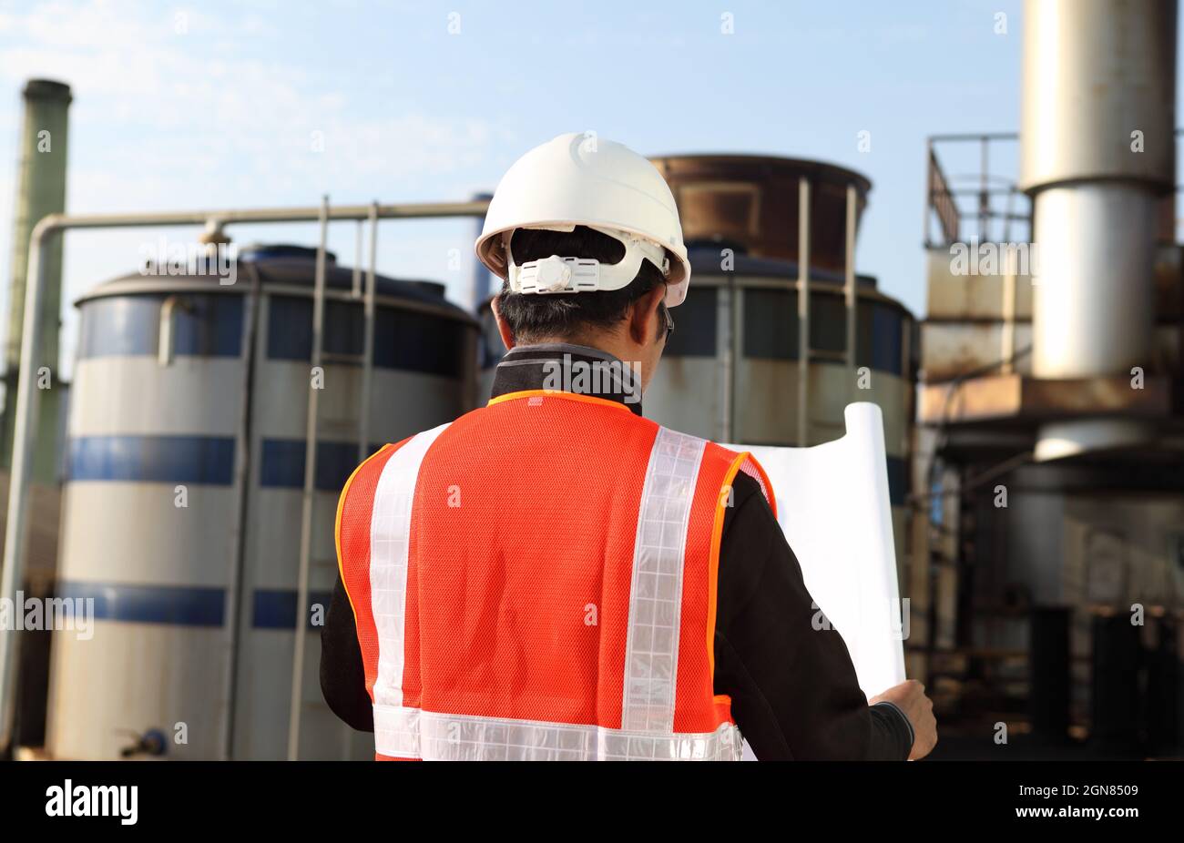 engineer checking a drawing Stock Photo - Alamy
