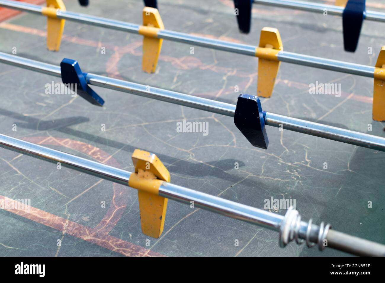 High angle shot of a foosball game with blue and yellow figures Stock ...