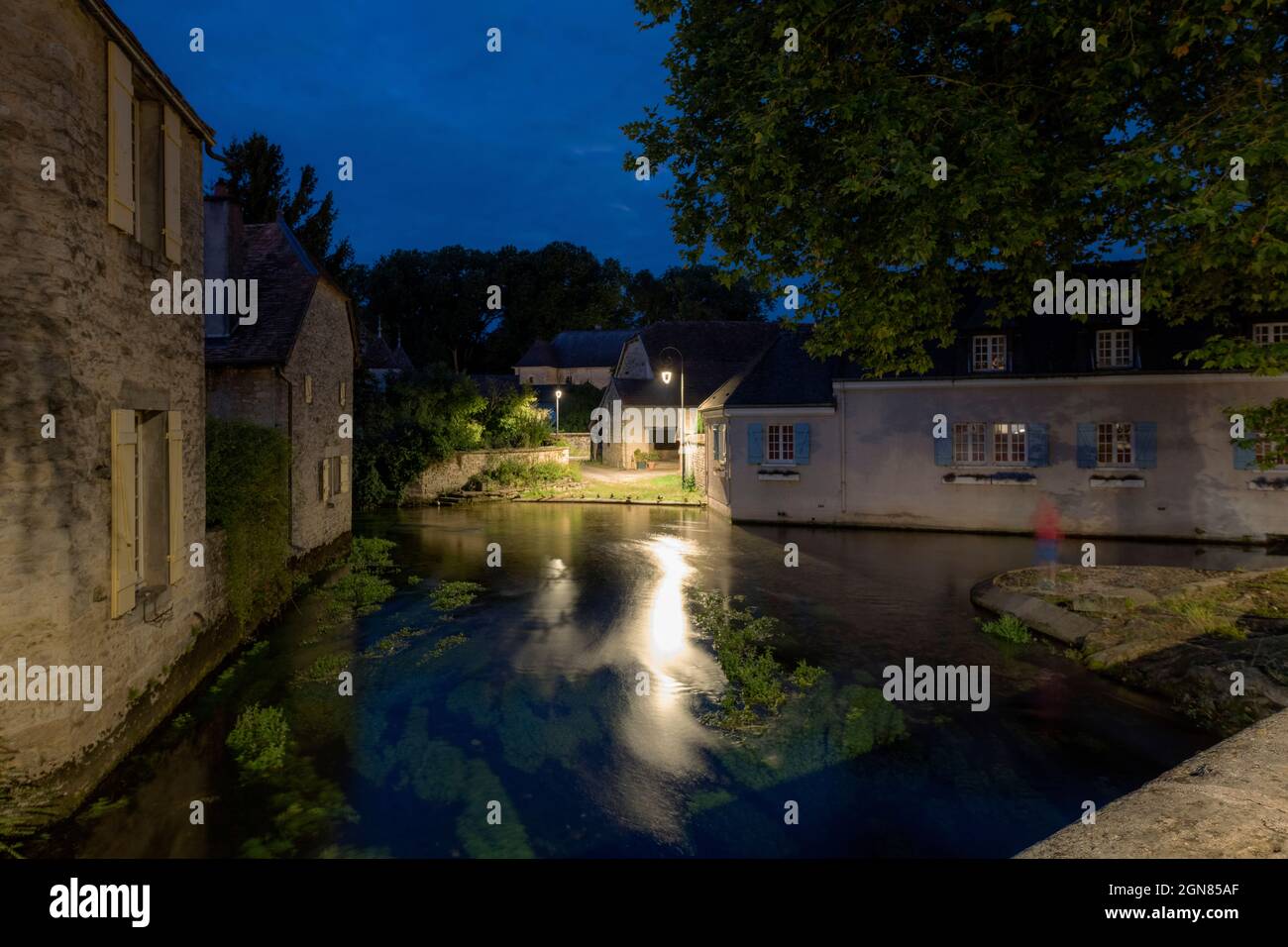 The River Beze and village houses at night in Beze, Cote d'Or, Burgundy ...