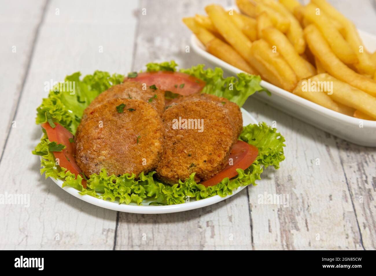 Closeup of the cutlets with french fries Stock Photo - Alamy