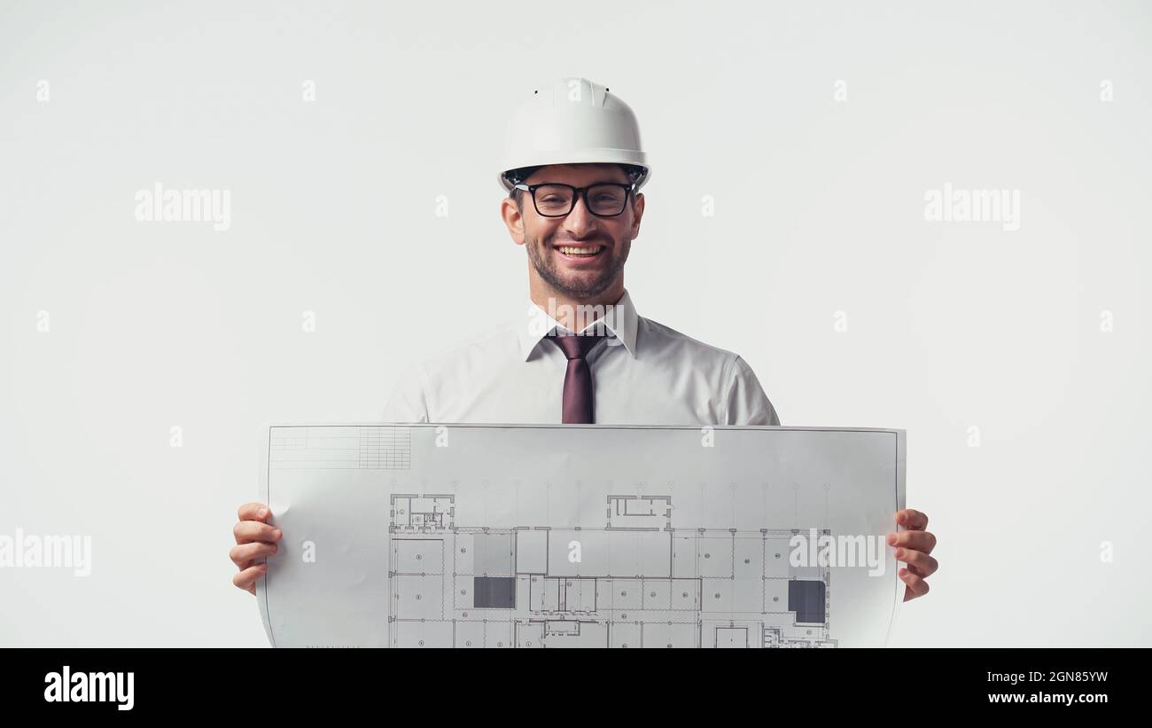 Cheerful engineer showing blueprint isolated on white Stock Photo - Alamy