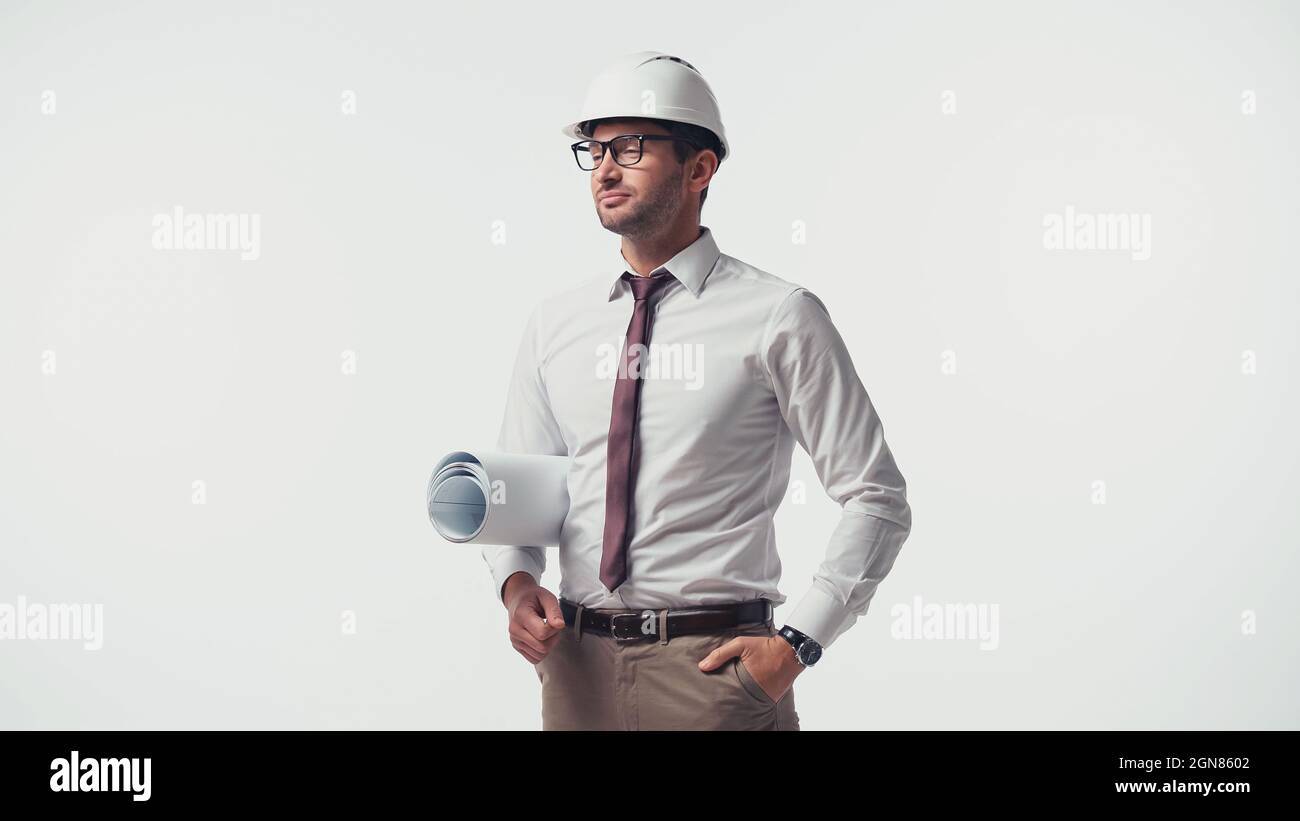 Engineer with blueprint standing isolated on white Stock Photo - Alamy