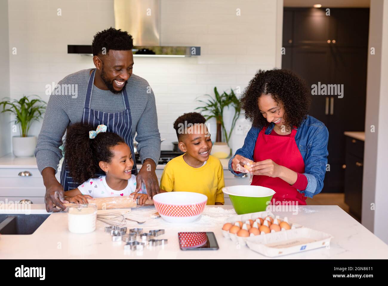 Happy african american family baking together in kitchen Stock Photo ...